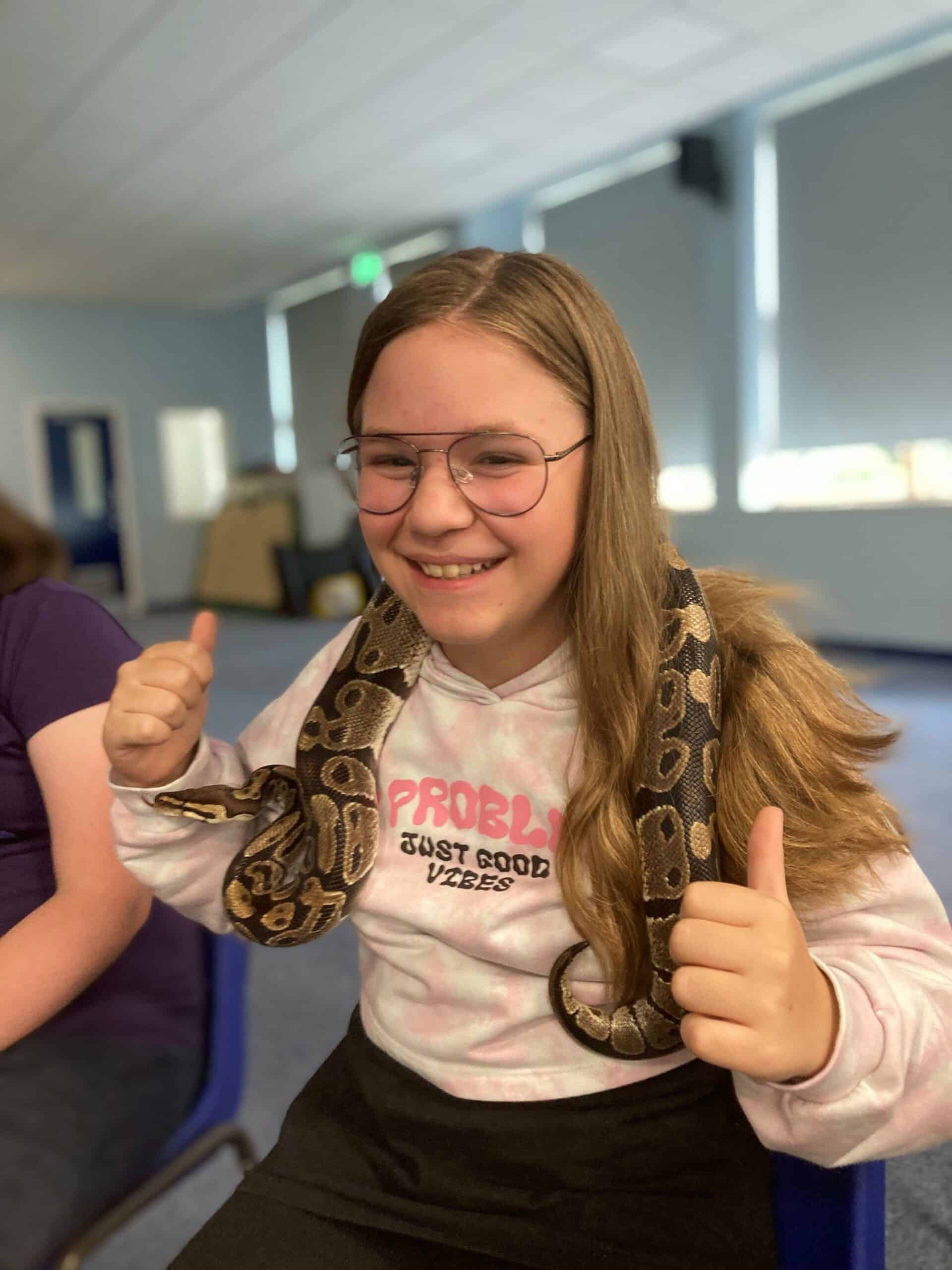 Derby children cuddle snakes and creepy crawlies during summer school ...